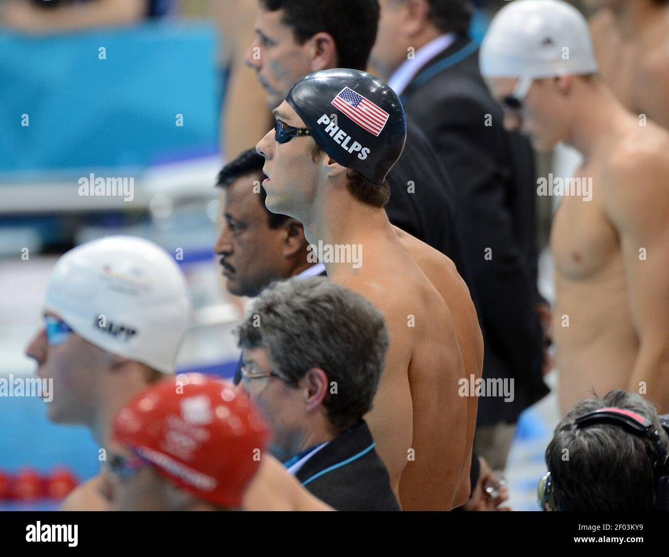 USA swimmer Michael Phelps watches teammate Ricky Berens swim the third ...