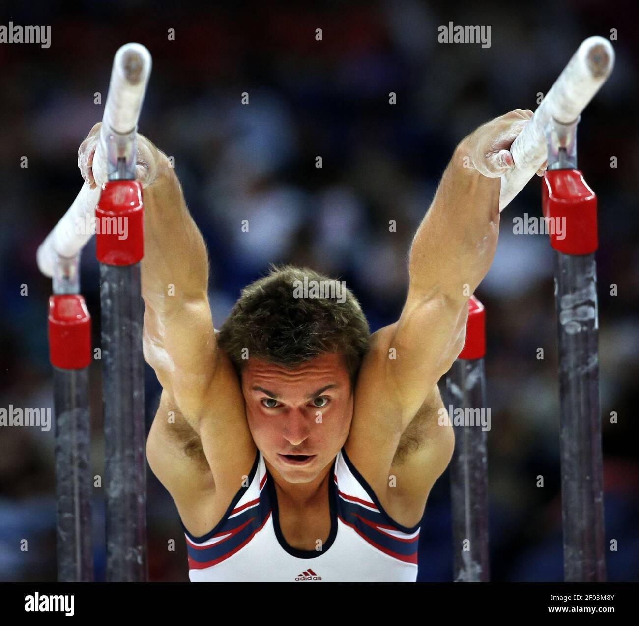 USA's Sam Mikulak competes on the parallel bars during the mens team ...