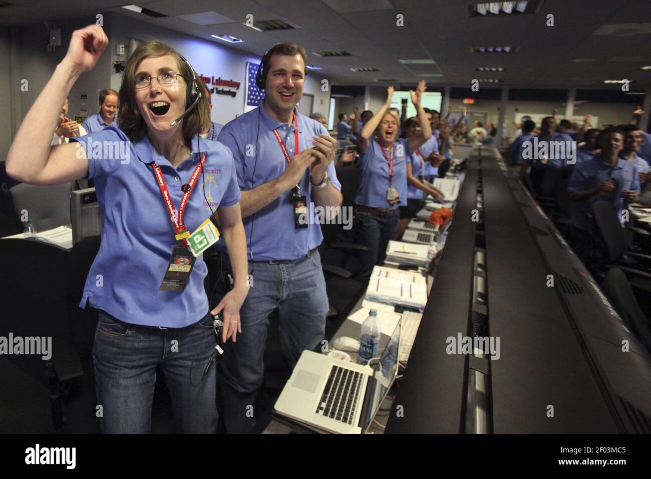 Kelley Clarke, left, celebrates as the first pictures appear on screen ...