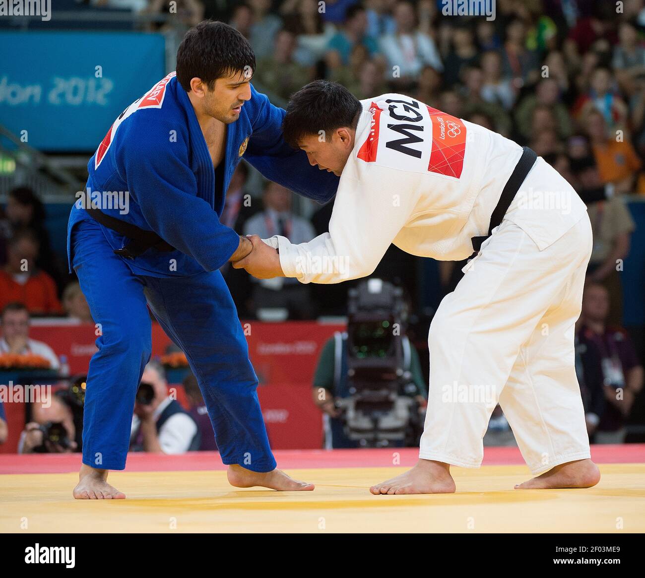 Russia's Tagir Khaibulaev competes with Mongolia's Tuvshinbayar Naidan ...