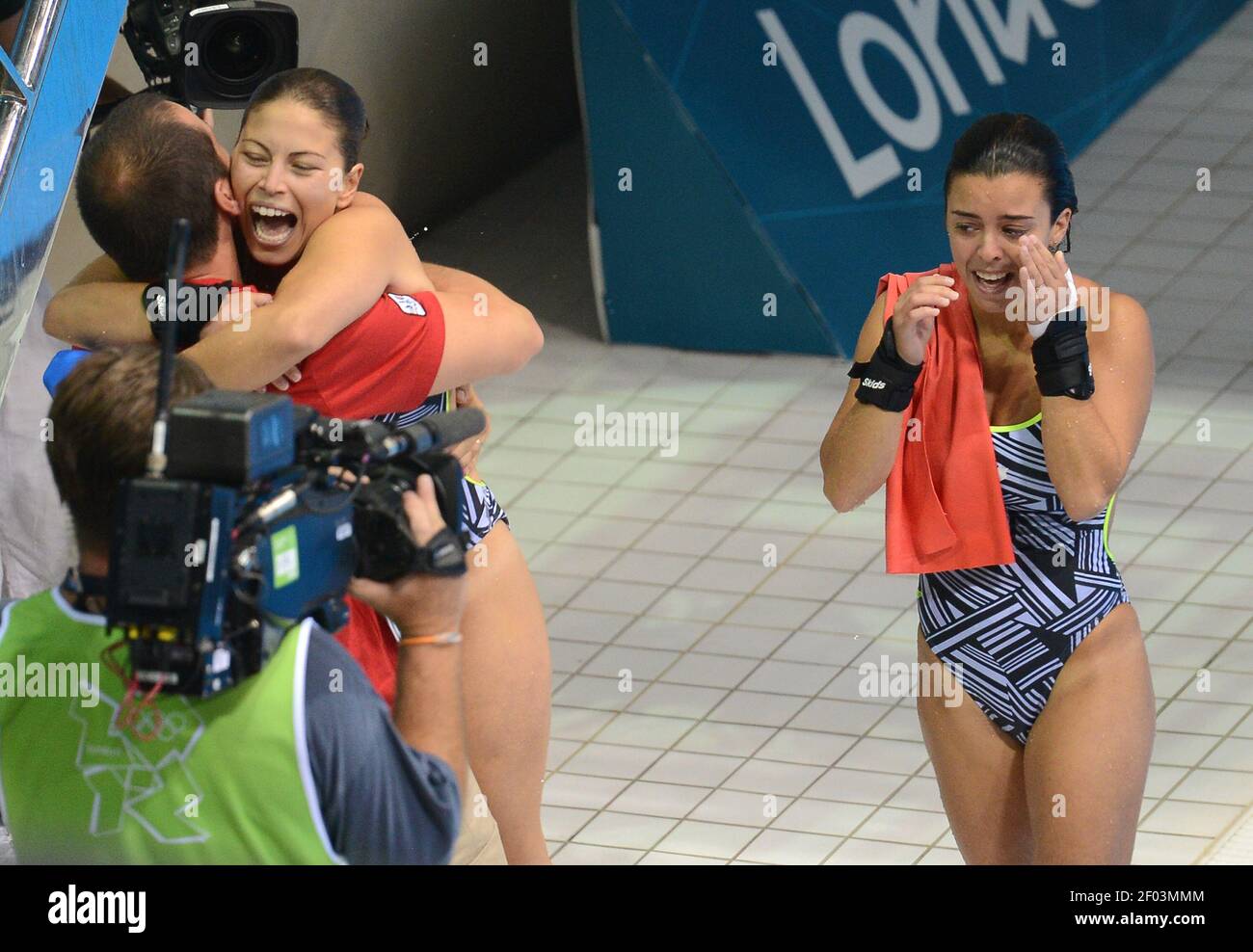 Canadian diver Roseline Filion, left, hugs a team member, as her ...