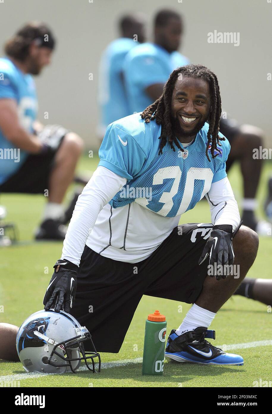 Carolina Panthers safety Charles Godfrey (30) smiles at a teammate as ...