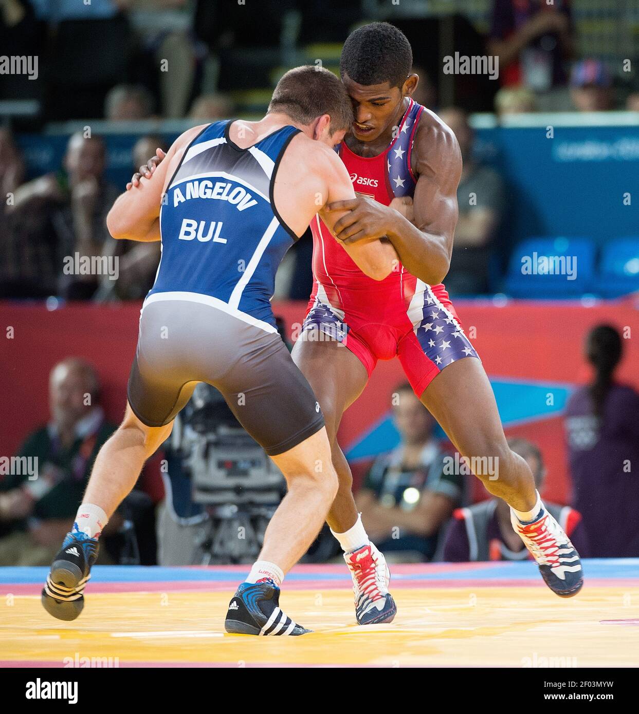 USA's Ellis Coleman (red) wrestles Bulgaria's Ivo Angelov (blue) during ...