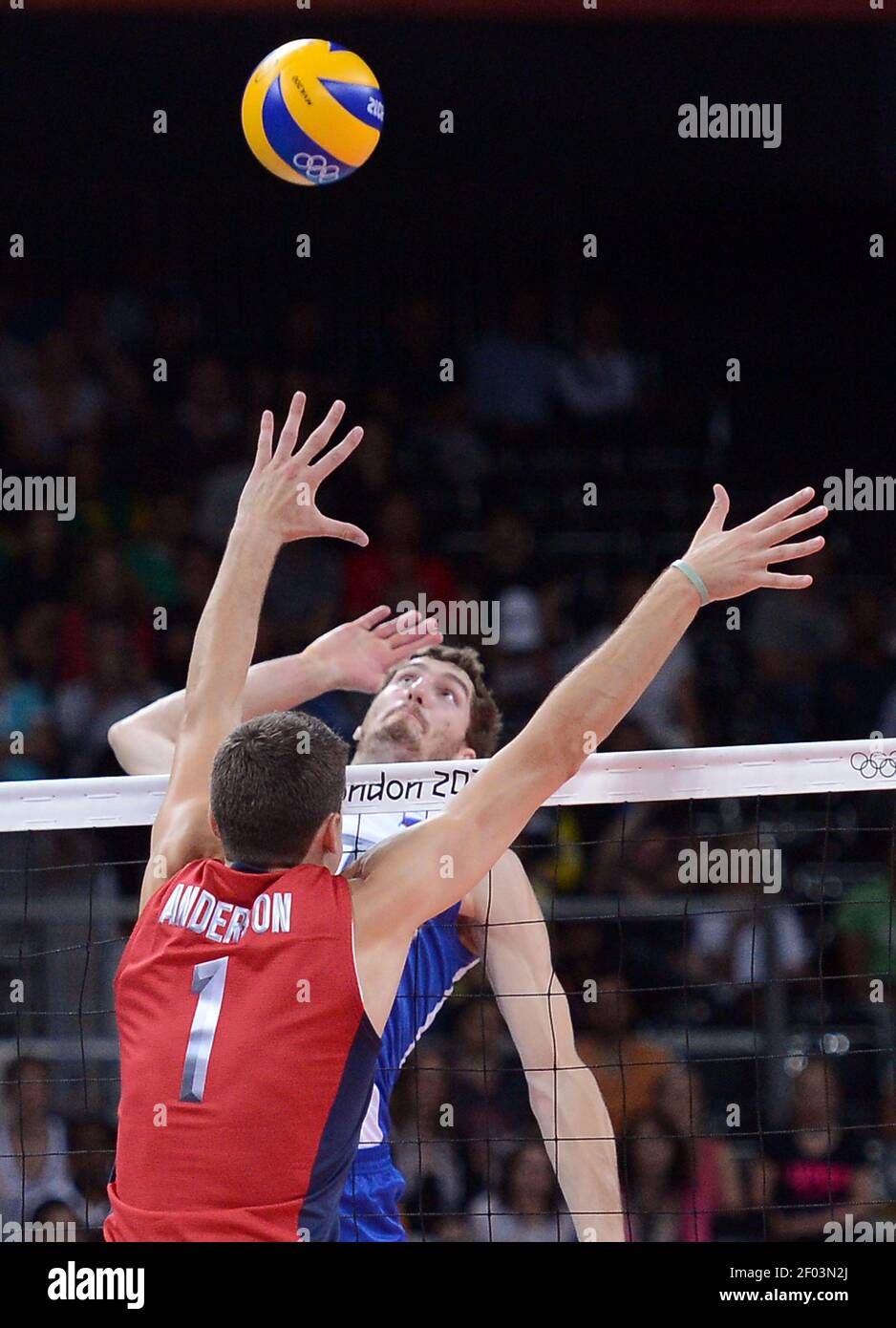 Russia's Maxim Mikhaylov lines up a spike as the USA's Matthew Anderson ...