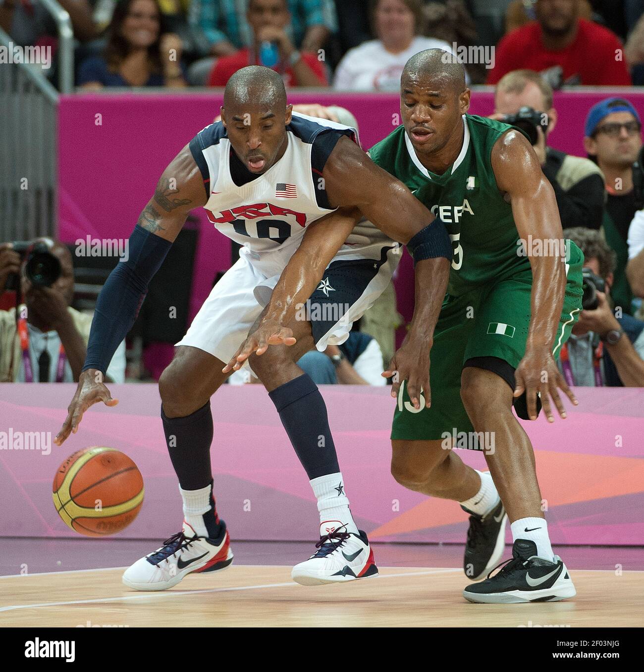 USA's Kobe Bryant (10) is guarded by Nigeria's Derrick Obasohan (13) during their game at the ...