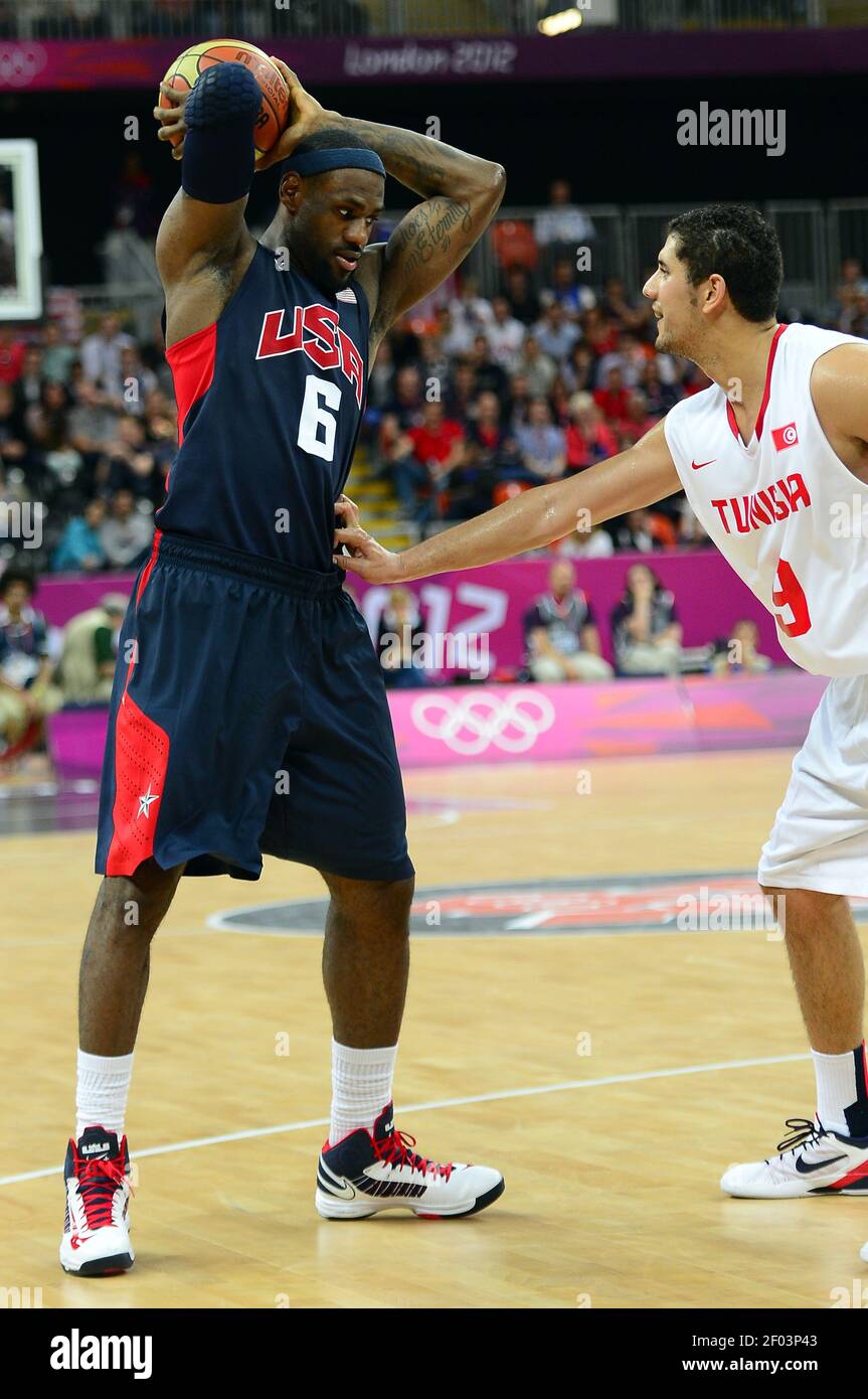 USA forward LeBron James (6) stares down Tunisia defender Marouan ...