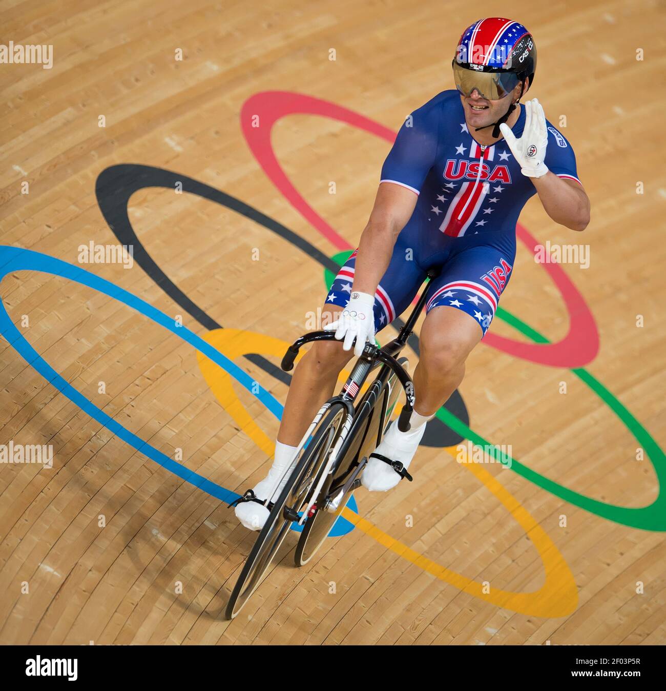 jimmy Watkins of the United States waved to the crowd after he advanced ...