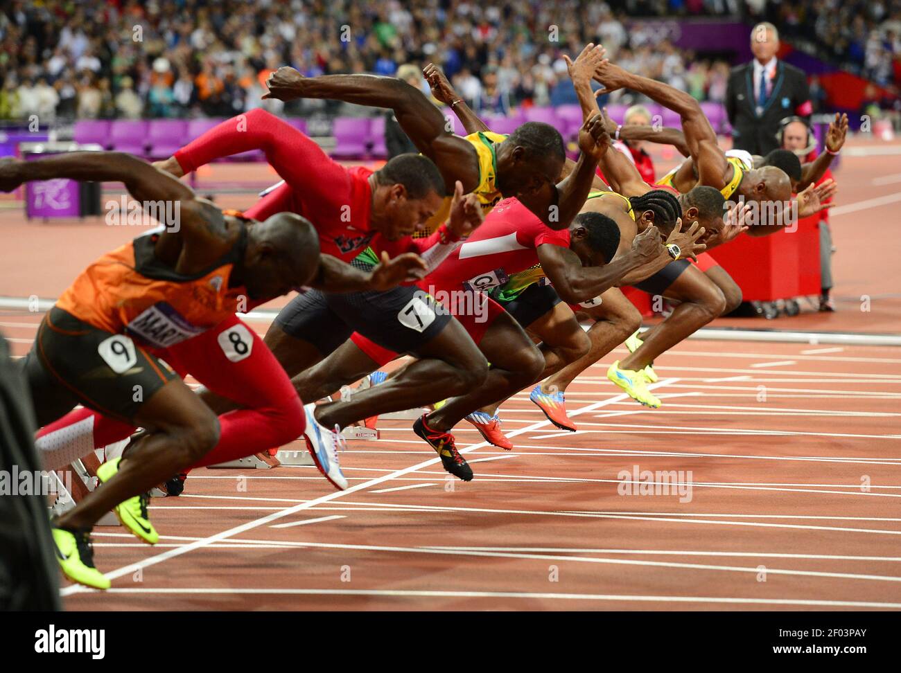 Usain Bolt of Jamaica, third from left, breaks from the start line for ...