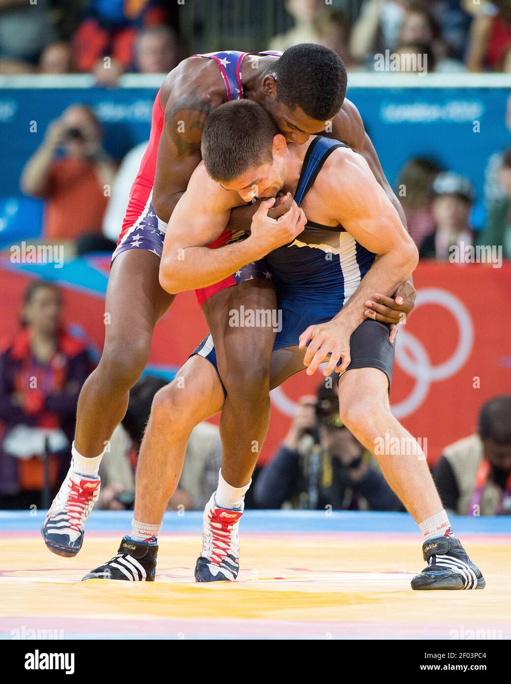 USA's Ellis Coleman (red) wrestles Bulgaria's Ivo Angelov (blue) during ...