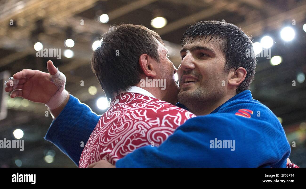 Russia's Tagir Khaibulaev hugs his coach after defeating Mongolia's ...