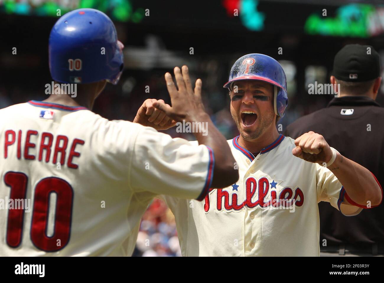 Philadelphia Phillies' Kevin Frandsen celebrates in front of Juan ...