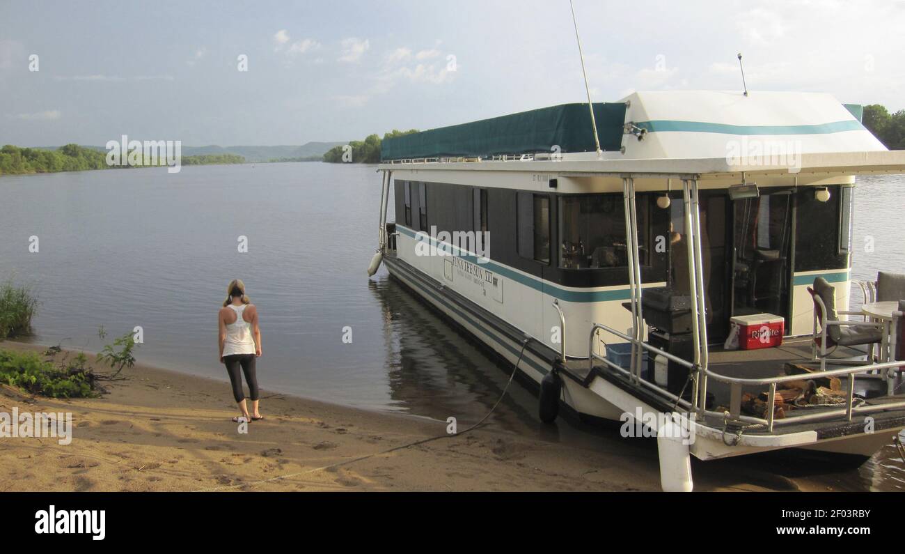 Watching the Mississippi River flow after a day on the houseboat ...