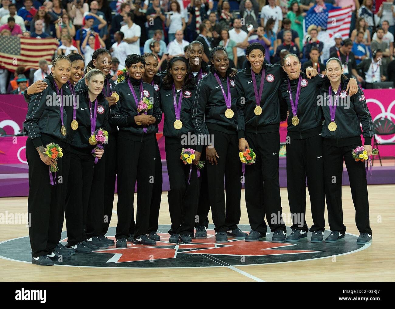 The USA Basketball team poses for photos after the Gold Medal ...