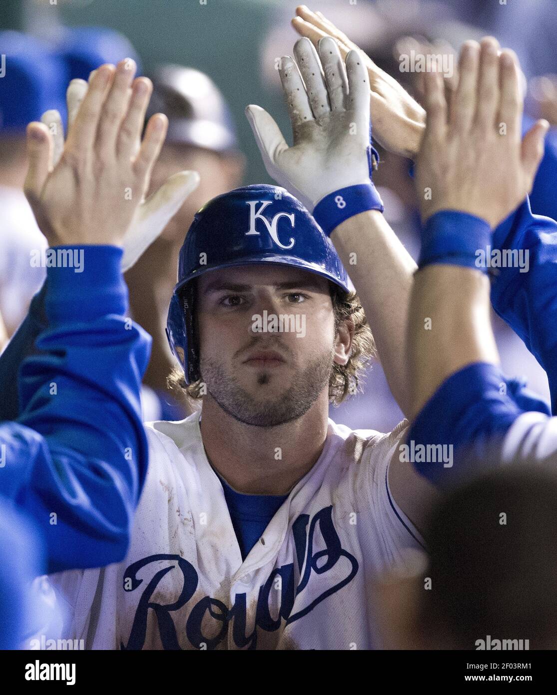 The Kansas City Royals' Mike Moustakas (8) is congratulated in the ...