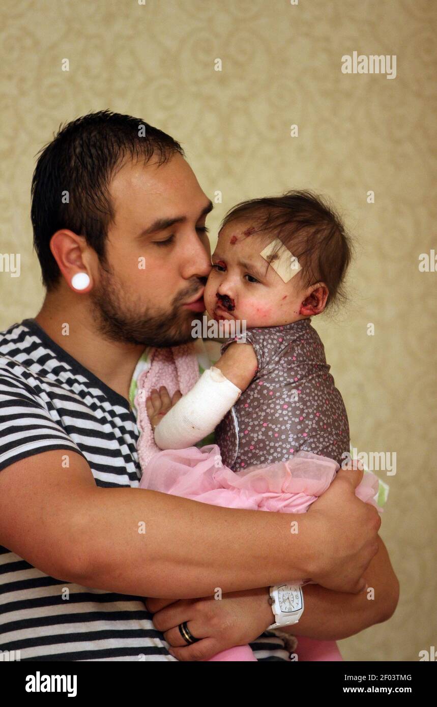 Tony Navarro, left, of New Jersey, gives his 15-month-old daughter Ava ...
