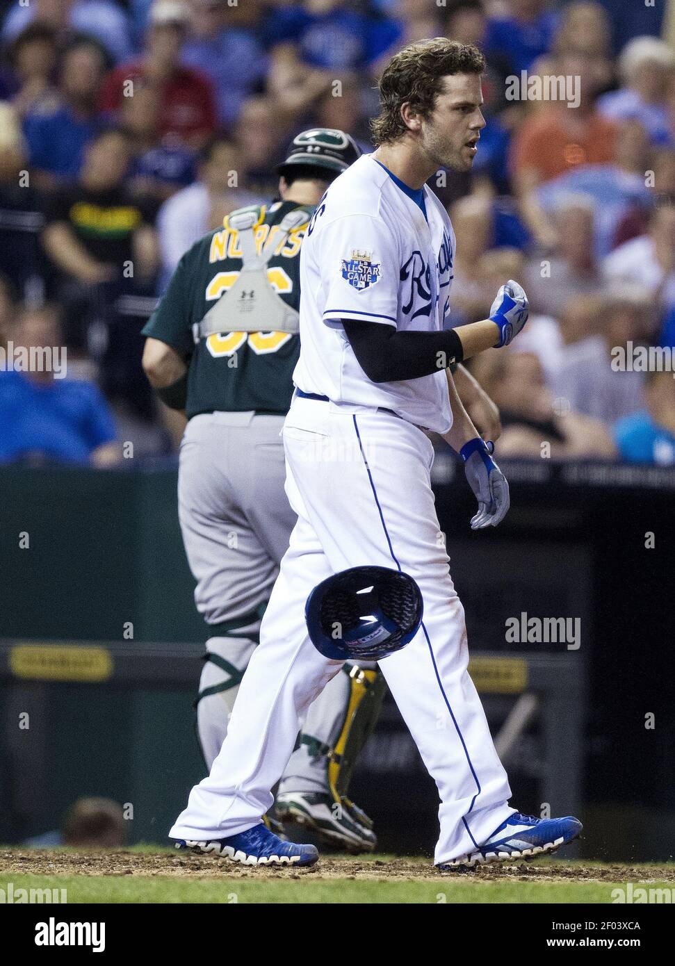 The Kansas City Royals' Mike Moustakas flips his helmet after a called ...