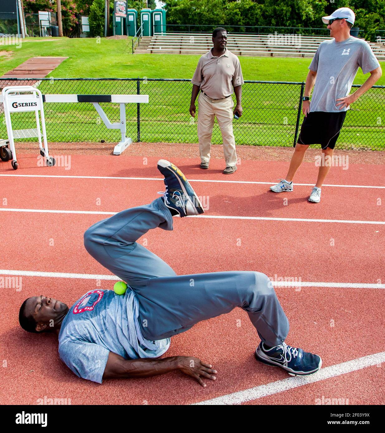 Jerome Singleton stretches under the direction of speed coach Jeremy ...