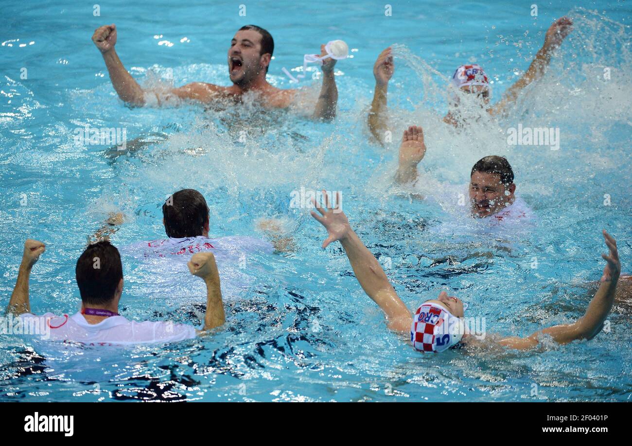 Croatia water polo team players and coach celebrate following an 8-6 ...