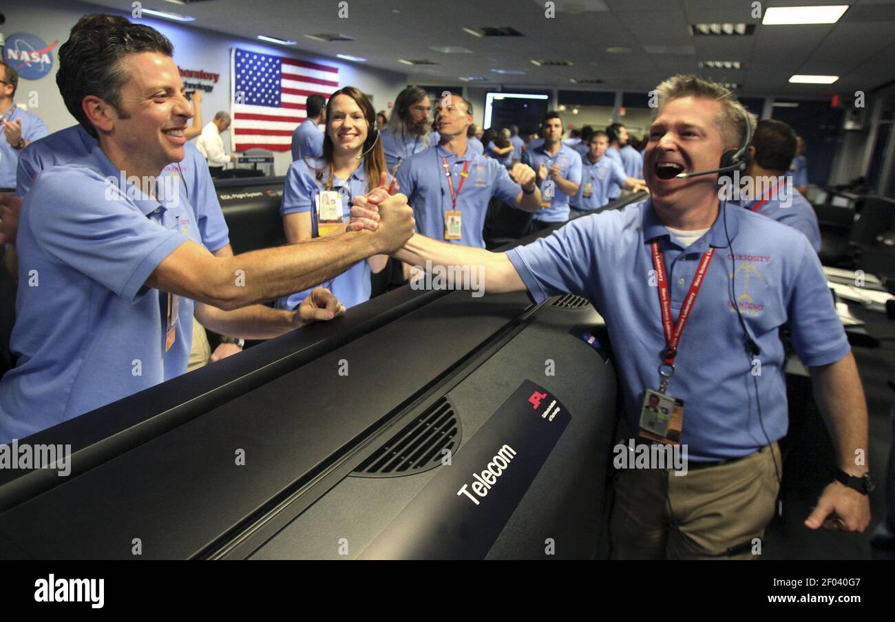 MSL Flight director Keith Comeaux, right, celebrates with Martin Greco ...