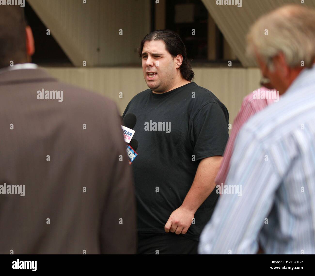 Nicholas Savio, the half-brother of Kathleen Savio, talks to the media ...