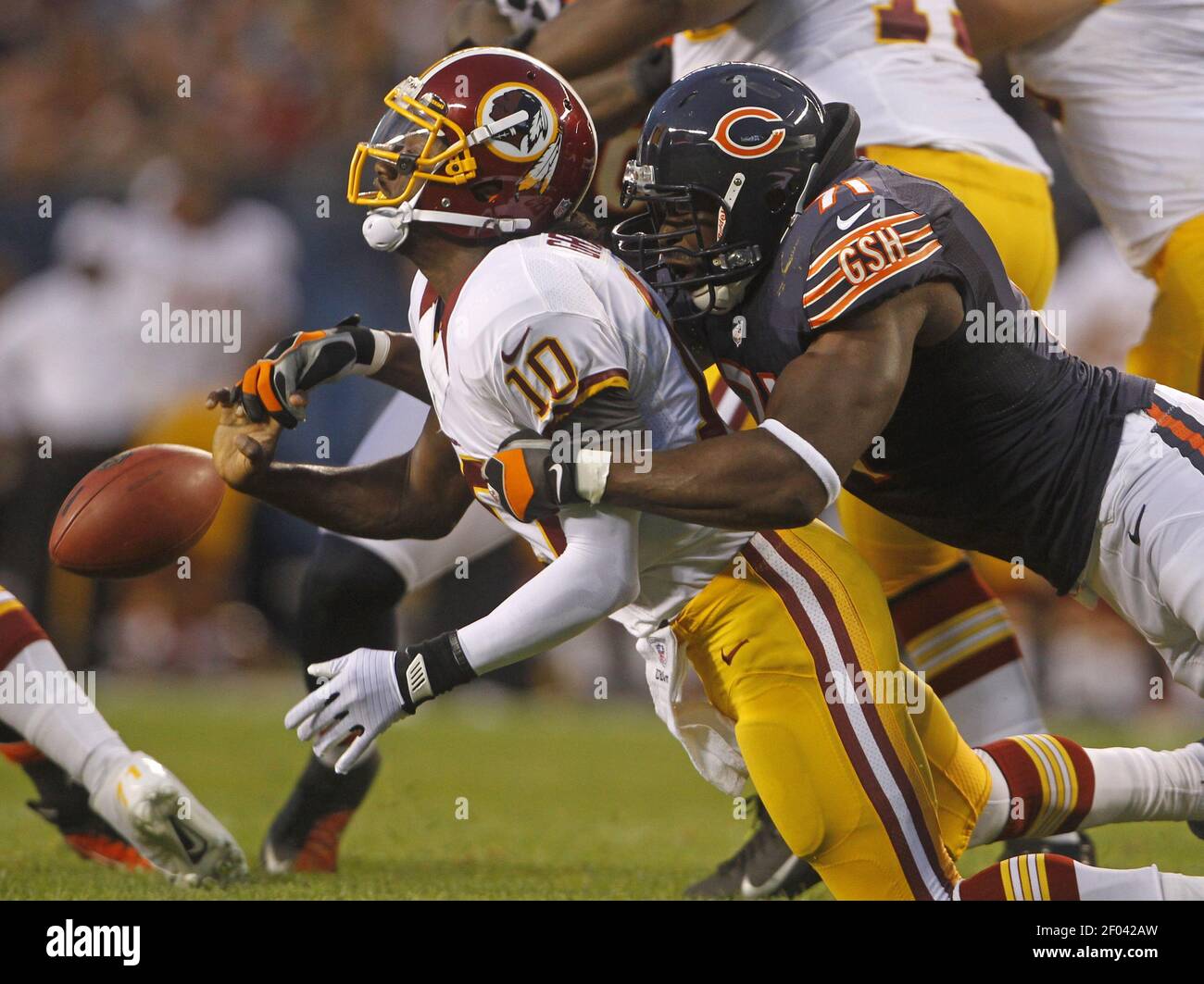 Chicago Bears defensive end Israel Idonije (71) sacks Washington ...