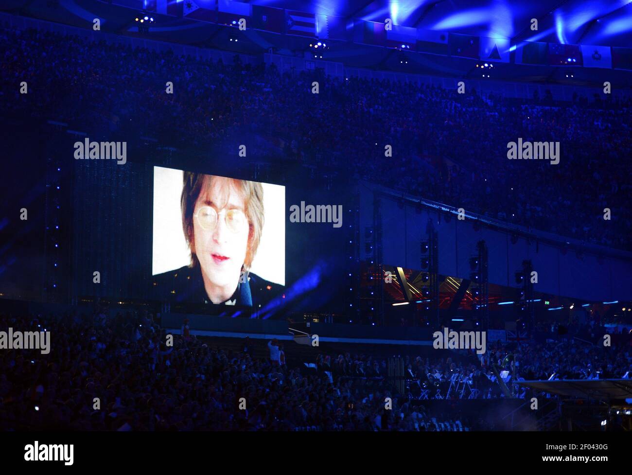 A video of the late John Lennon singing "Imagine" plays at the Olympic ...