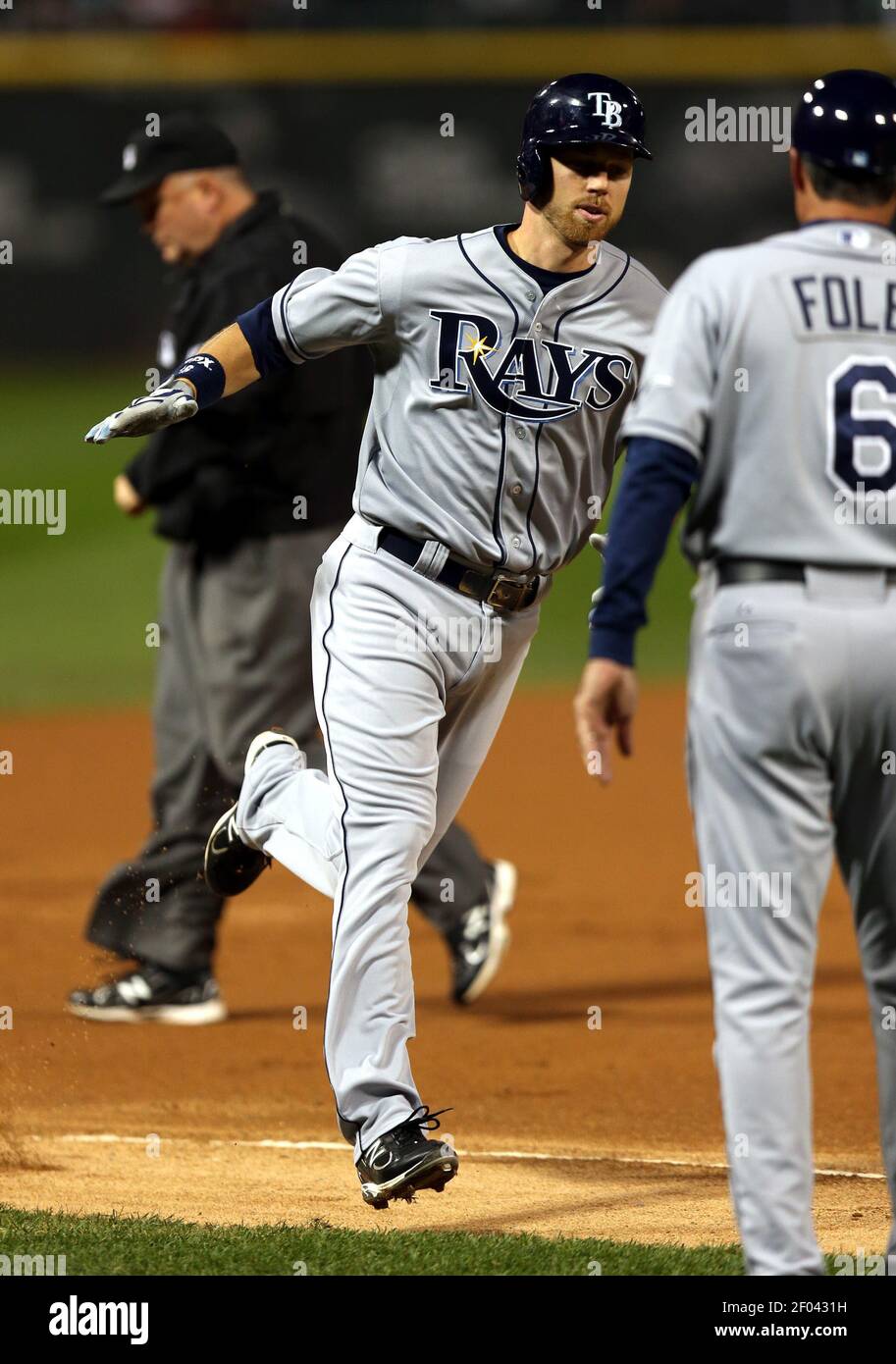 Tampa Bay Rays' Ben Zobrist is congratulated by third base coach Tom ...