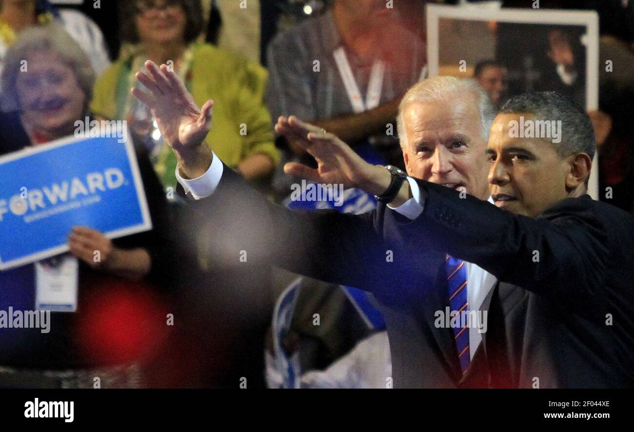 President Barack Obama and Vice President Joe Biden wave to the crowd ...