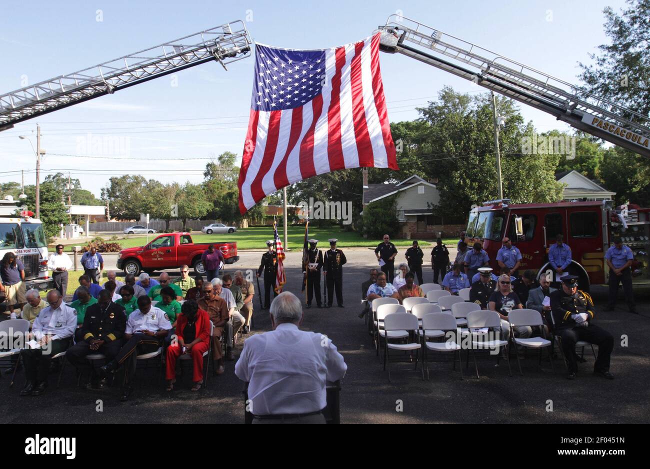 The Rev. David Greer says a prayer of unity during a ceremony at Moss ...