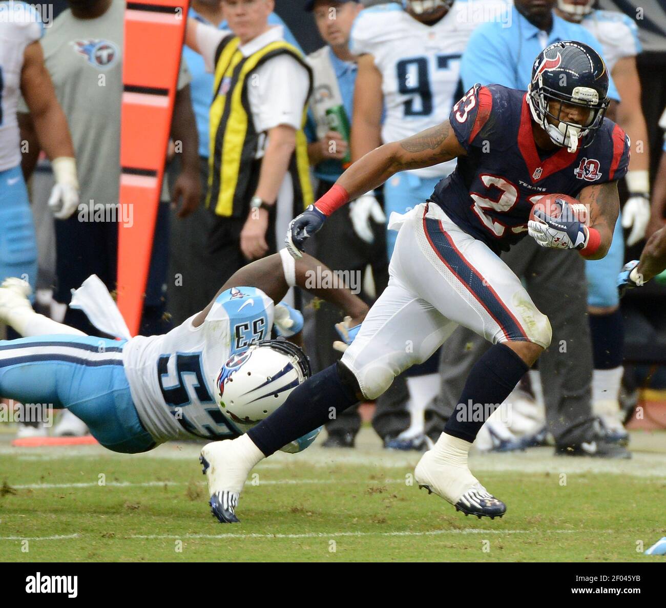 Arian Foster (23) of the Houston Texans tries to elude the tackle of ...