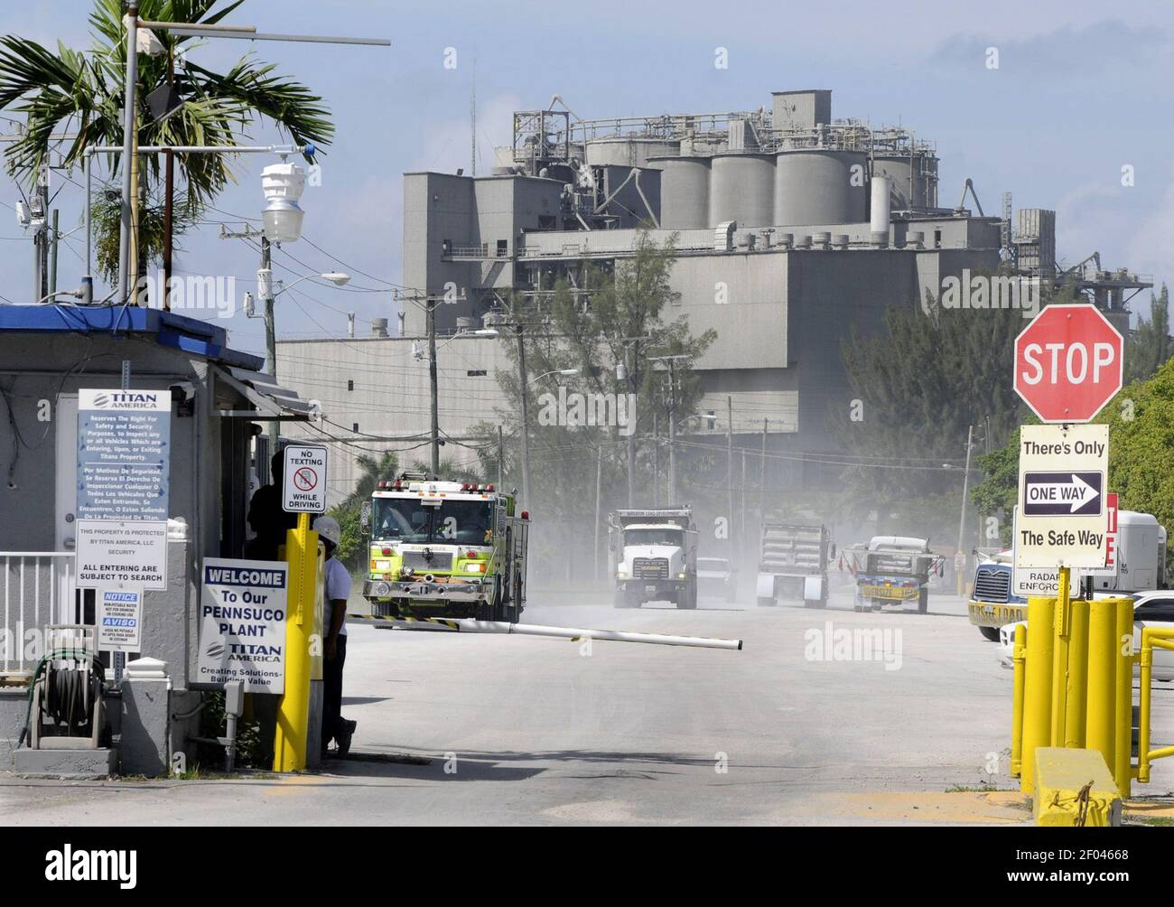 A Miami-Dade Fire Engine leaves the Titan America Cement plant in ...