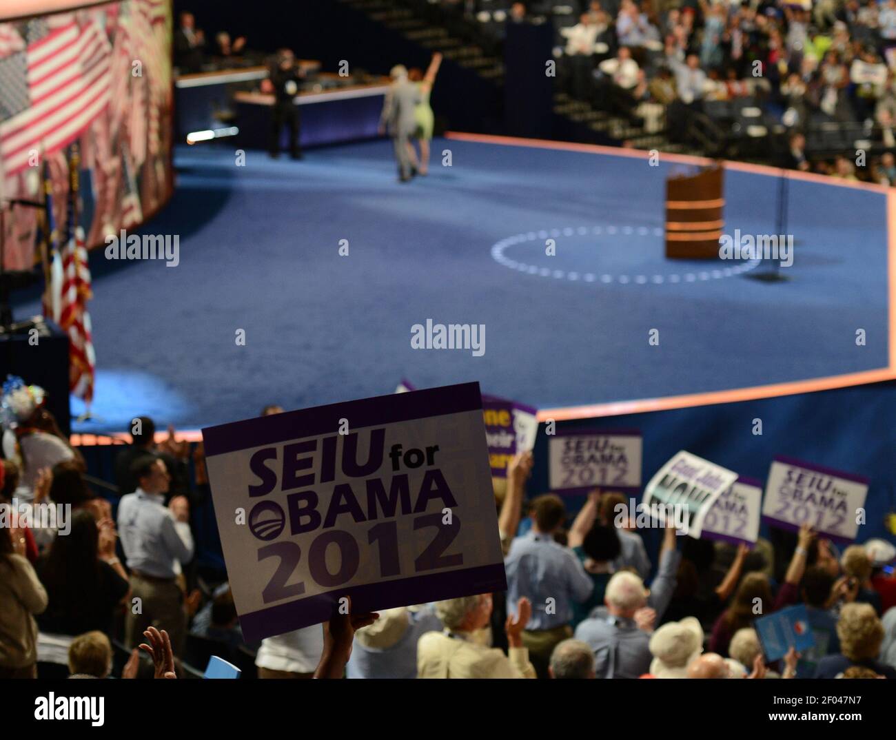Signs are raised at the 2012 Democratic National Convention at the Time ...