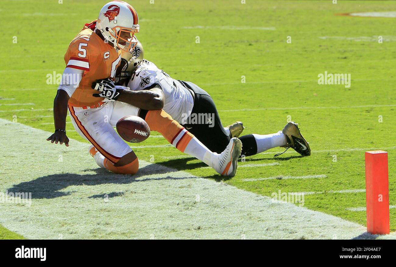 Tampa Bay Buccaneers quarterback Josh Freeman (5) is stopped by New ...
