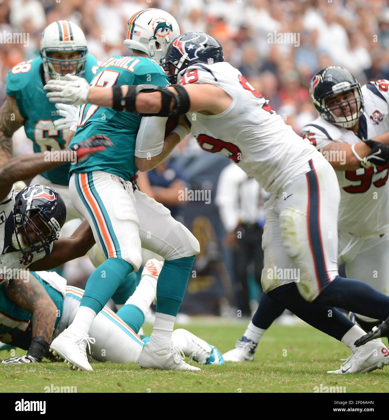 Quarterback Ryan Tannehill (17) of the Miami Dolphins is sacked by J.J ...