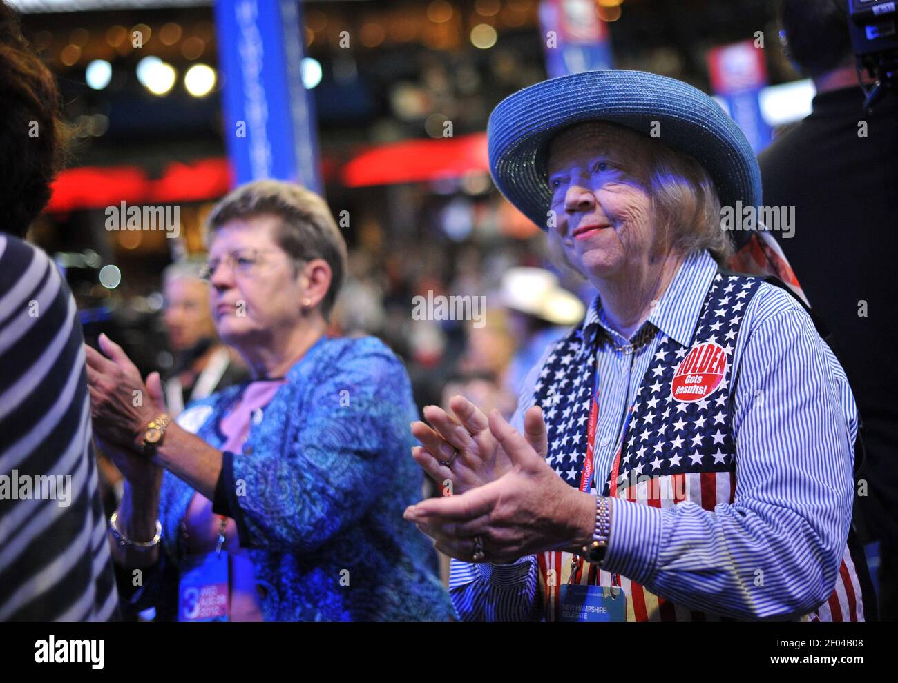 New Hampshire delegates applaud the National Anthem at the start of the ...