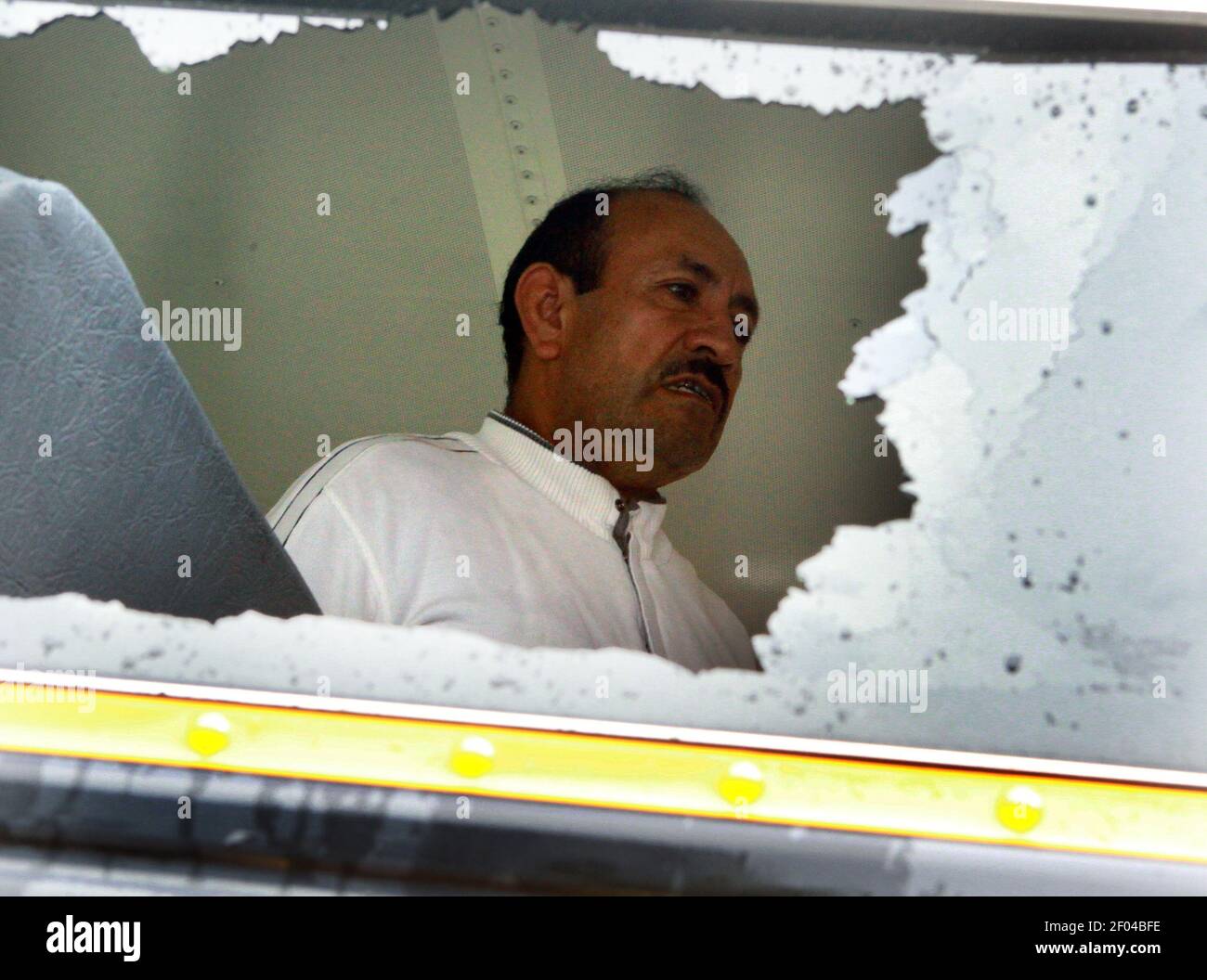 School bus driver Jamie Carillo stands inside the bus following a ...