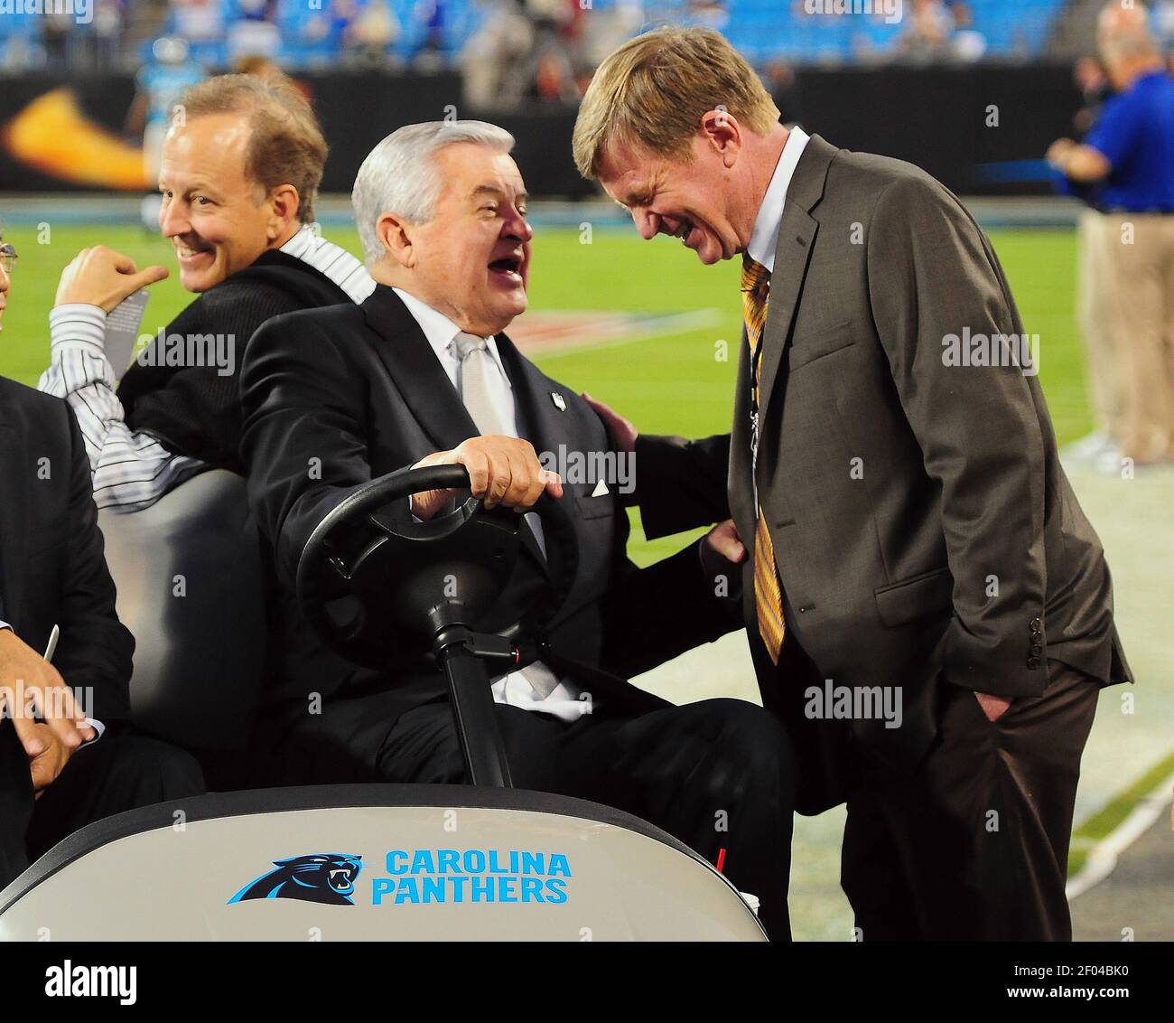 Carolina Panthers owner Jerry Richardson, center, enjoys a laugh with ...
