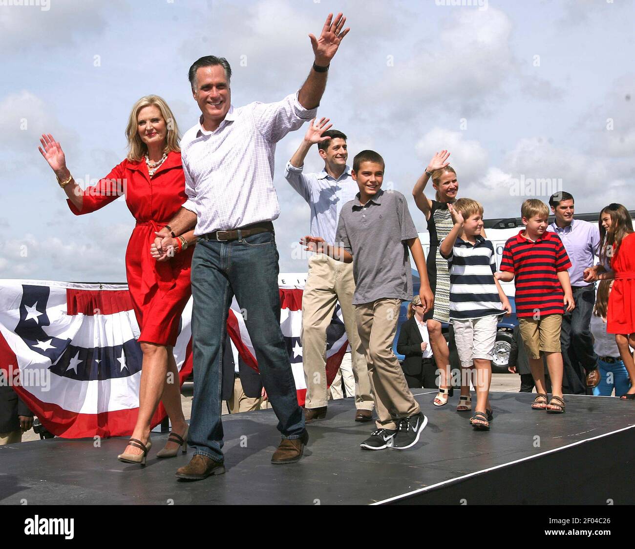 The Romneys and Ryans wave to cheering supporters at the end of a send ...