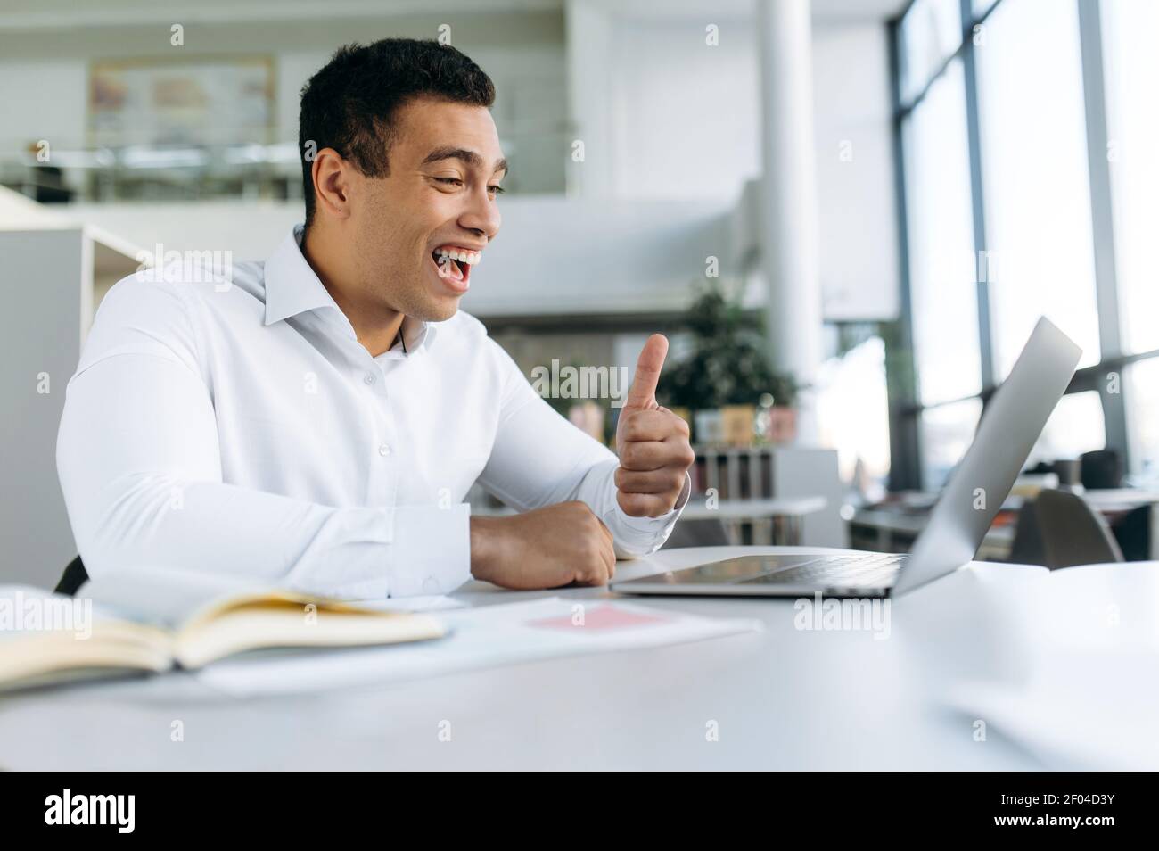 A confident satisfied male business man on video briefing. Successful ...