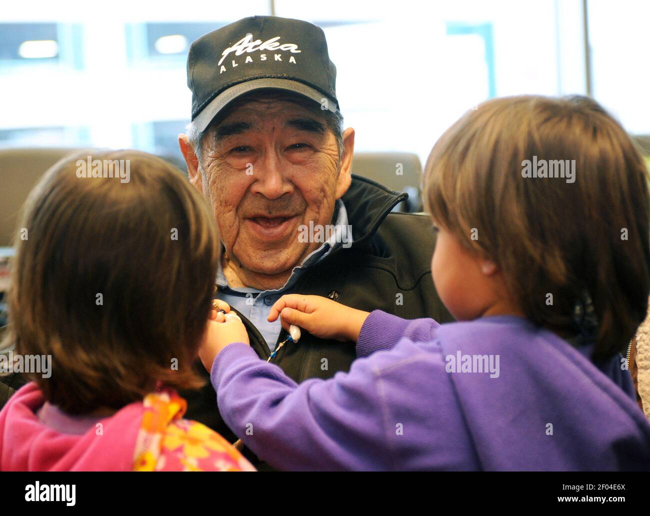 Nick Golodoff, author of Attu Boy, center, is greeted by young family ...
