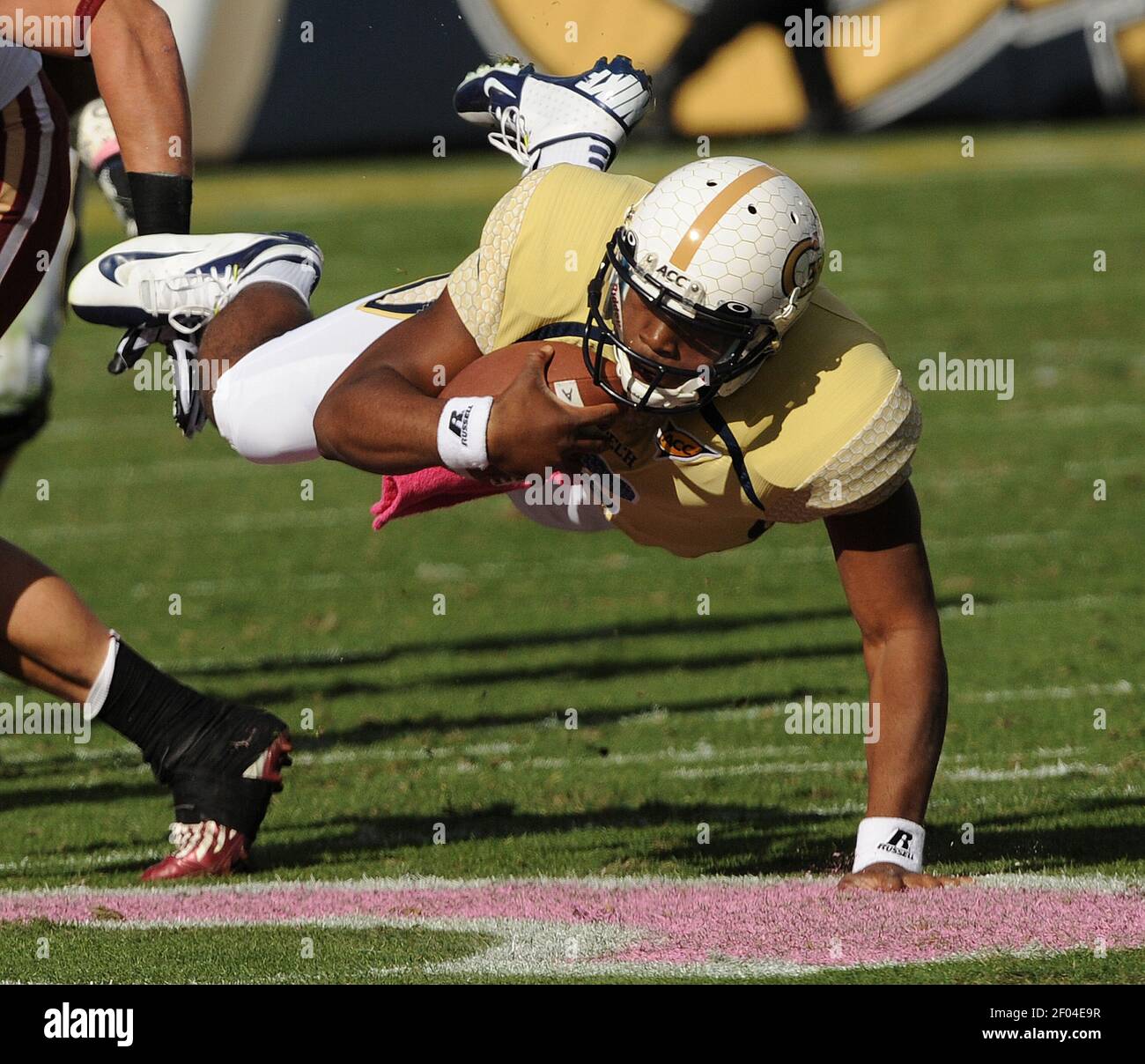 Georgia Tech's Vad Lee uses one hand to stay in the air after taking a ...