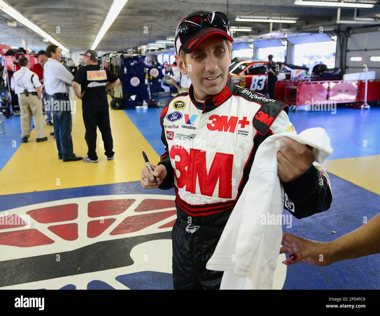 NASCAR driver Greg Biffle signs an autograph on Friday, October 12 ...