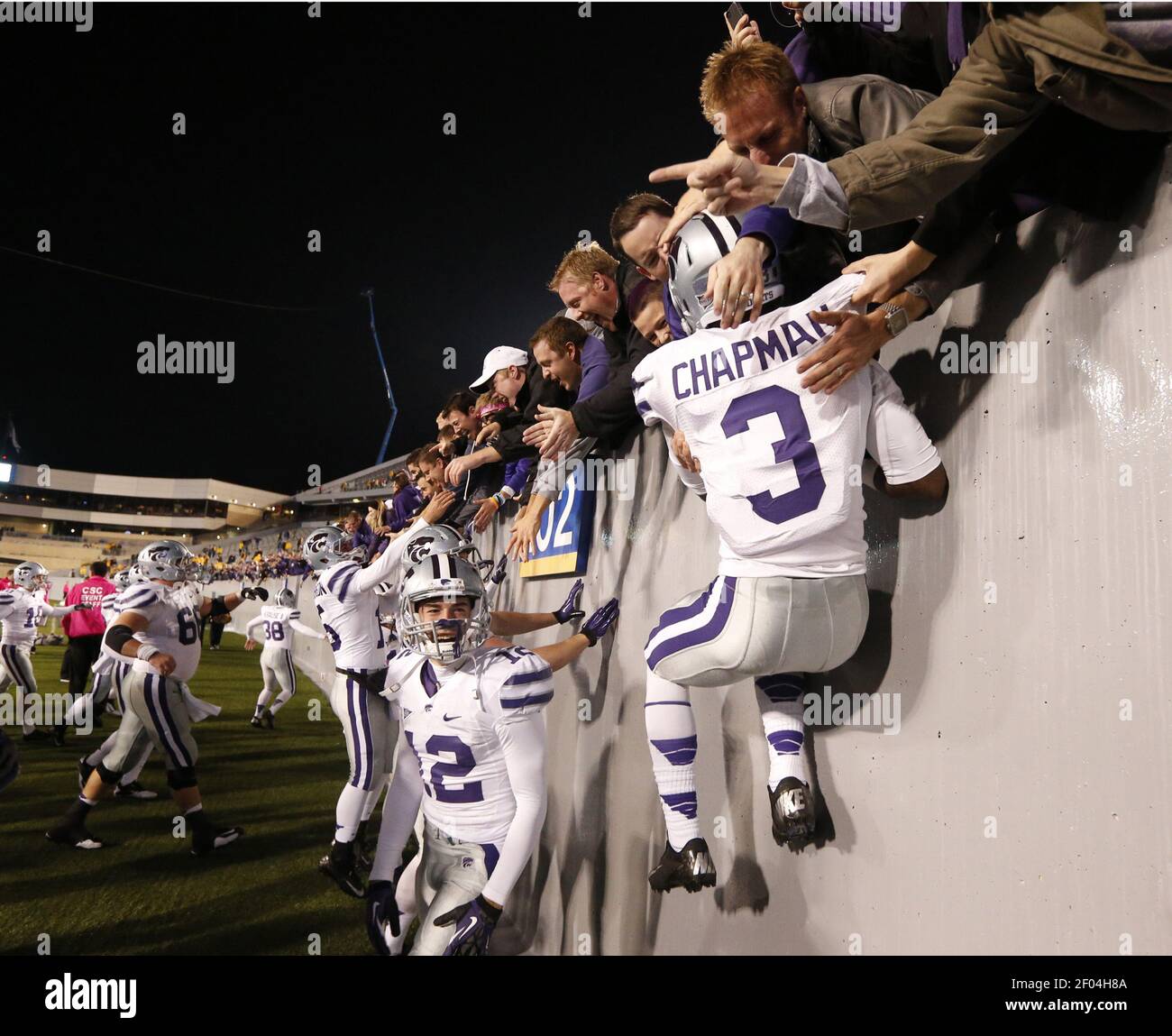 Kansas State fans celebrate with their team after a 55-14 win over West ...