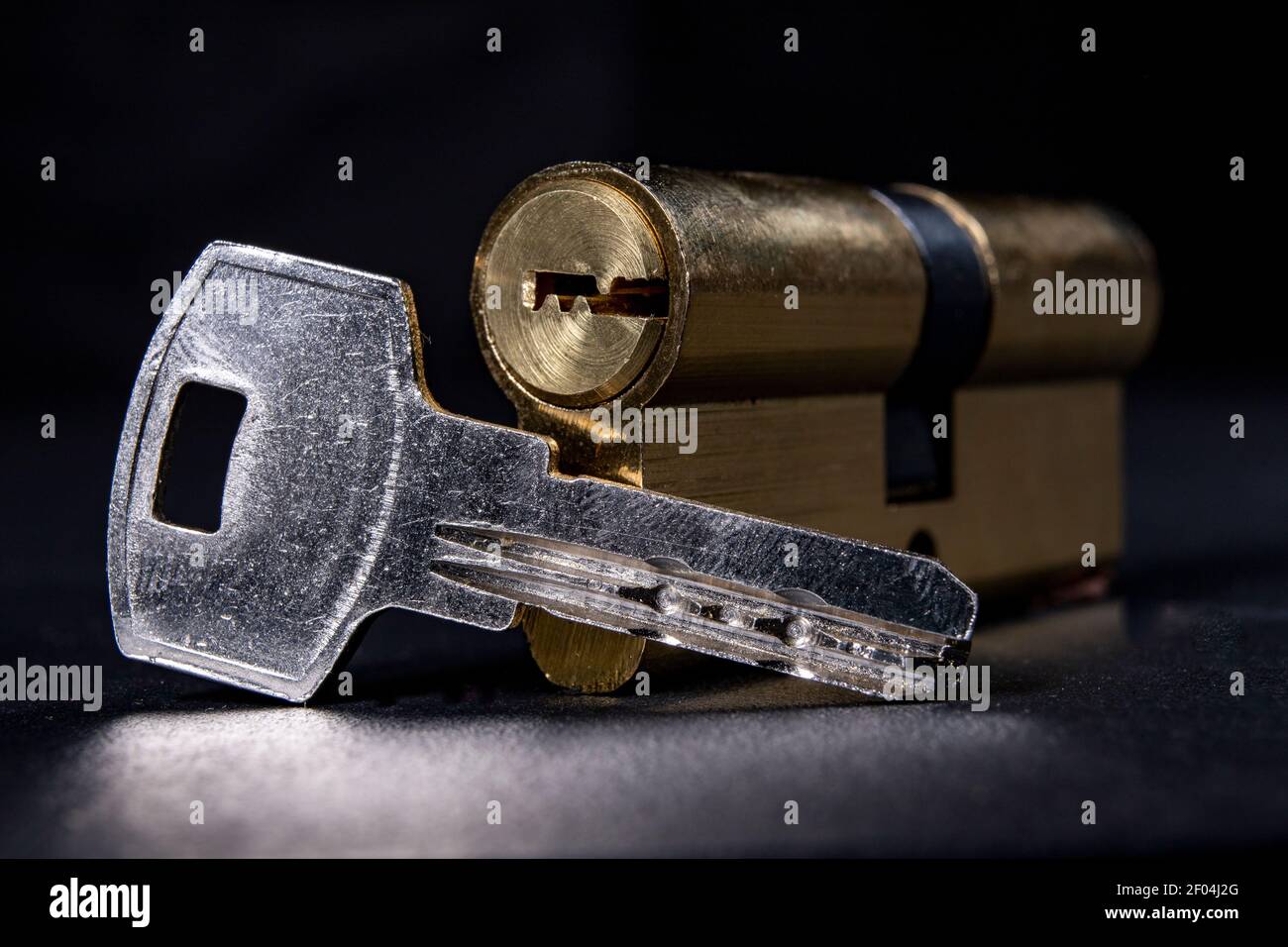 Silver keys and a lock for the front door. Household security system ...