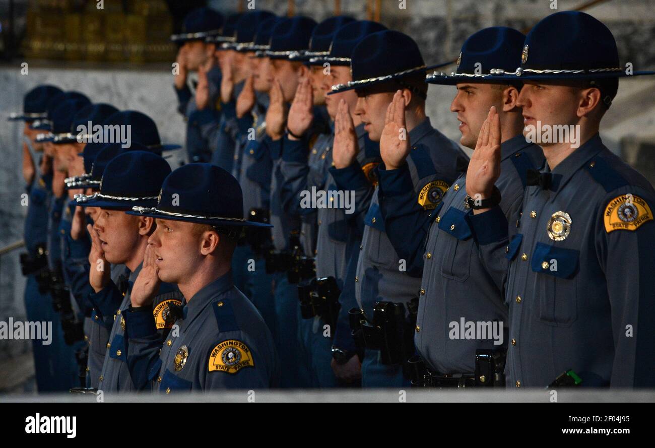 Graduates take the oath during the 100th Washington State Trooper ...