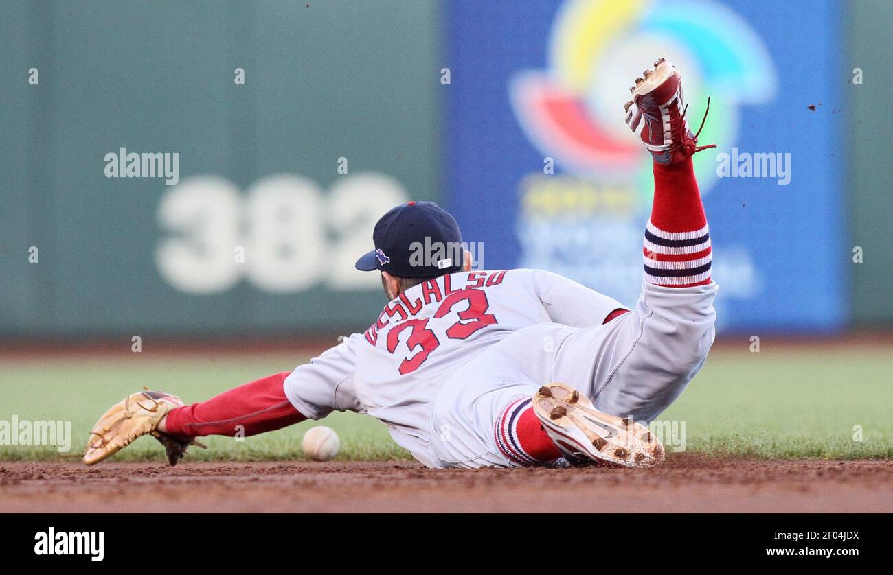 St. Louis Cardinals second baseman Daniel Descalso dives after a run ...