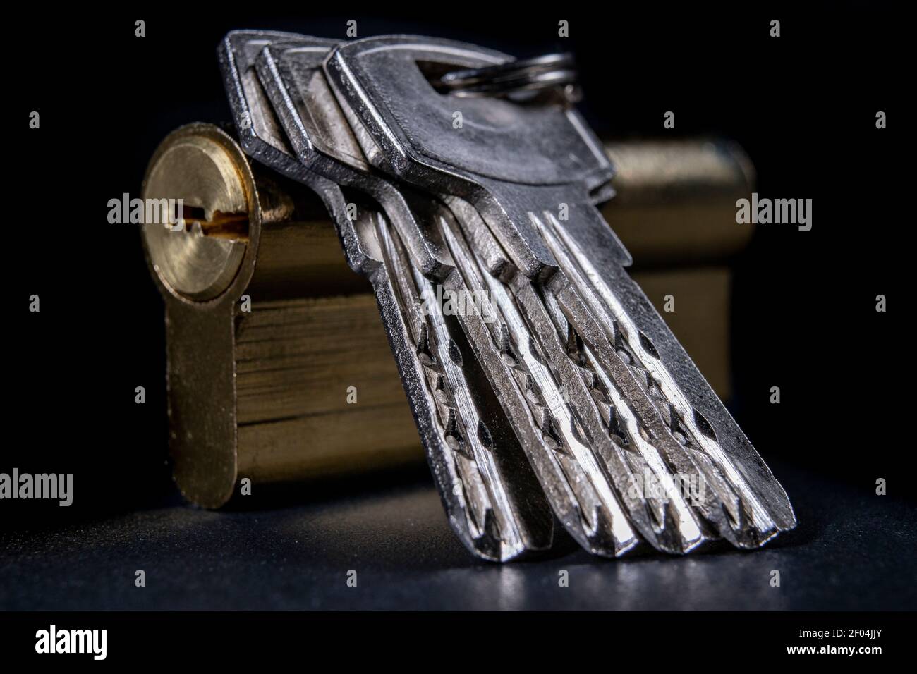 Silver keys and a lock for the front door. Household security system ...