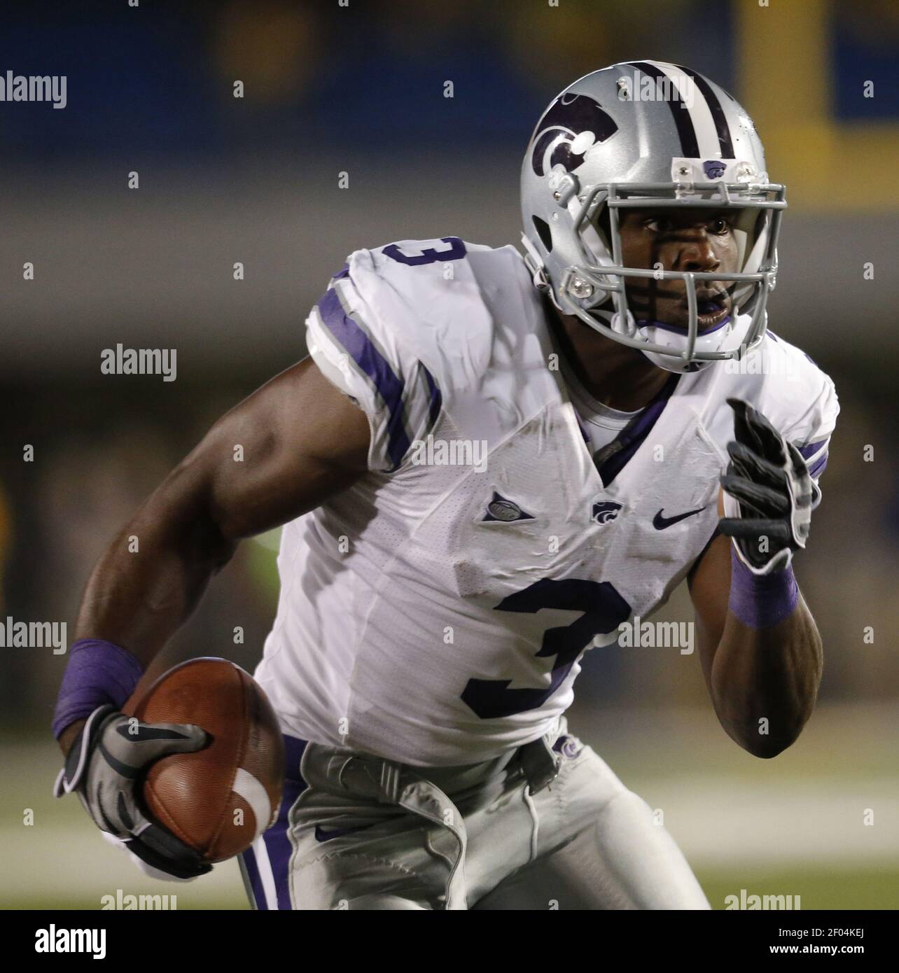 Kansas State wide receiver Chris Harper (3) looks for running room ...