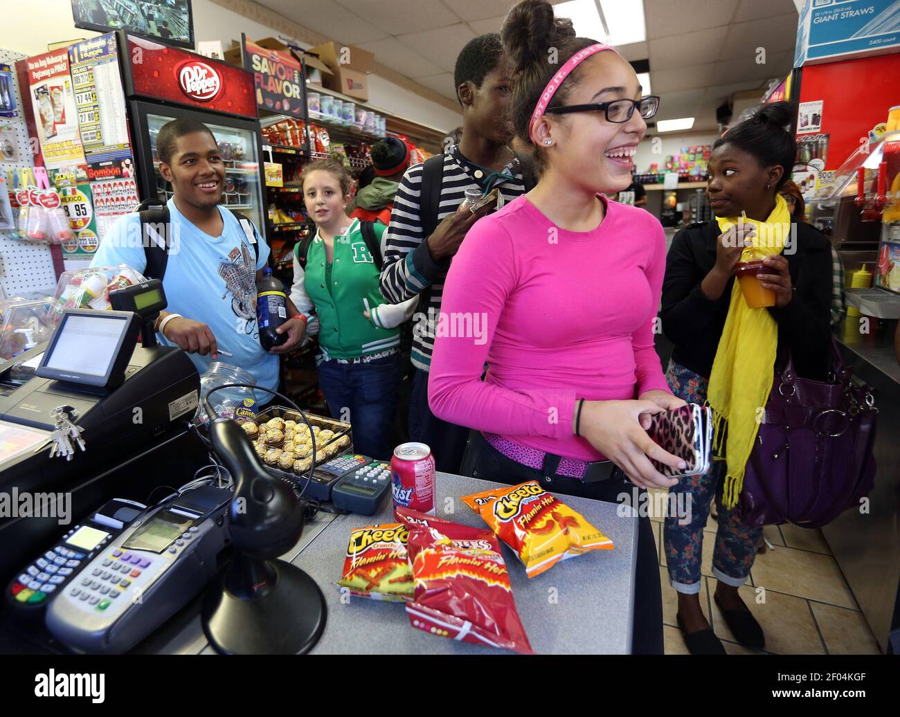 Zian Garcia, 15, purchases a variety of Flamin' Hot flavored chips at ...