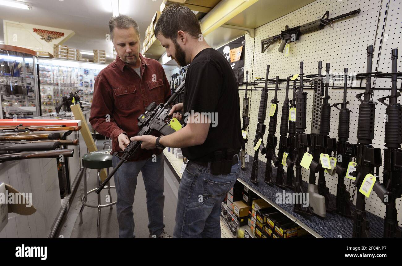 Sales representative Jason Brown, left, shows Steve Levy, of Rolesville ...